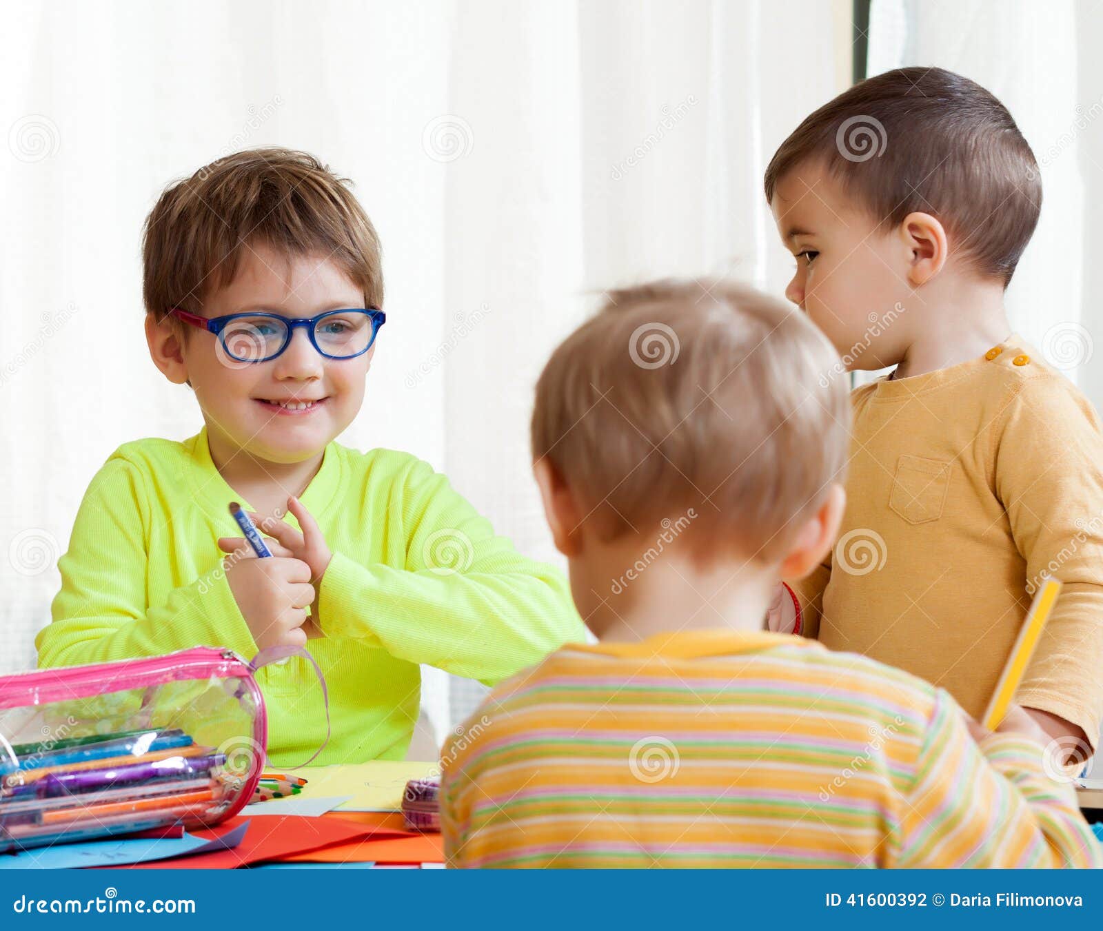 Three children drawing stock photo. Image of kids, easel - 41600392