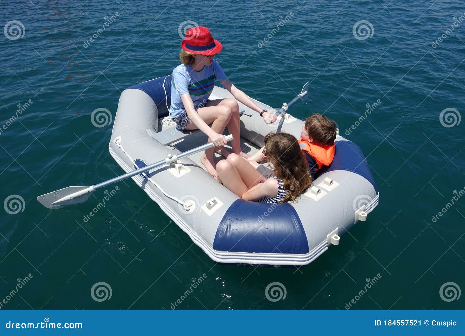 Inflatable Dinghy Boat On A Blue Sea Water Royalty-Free Stock ...