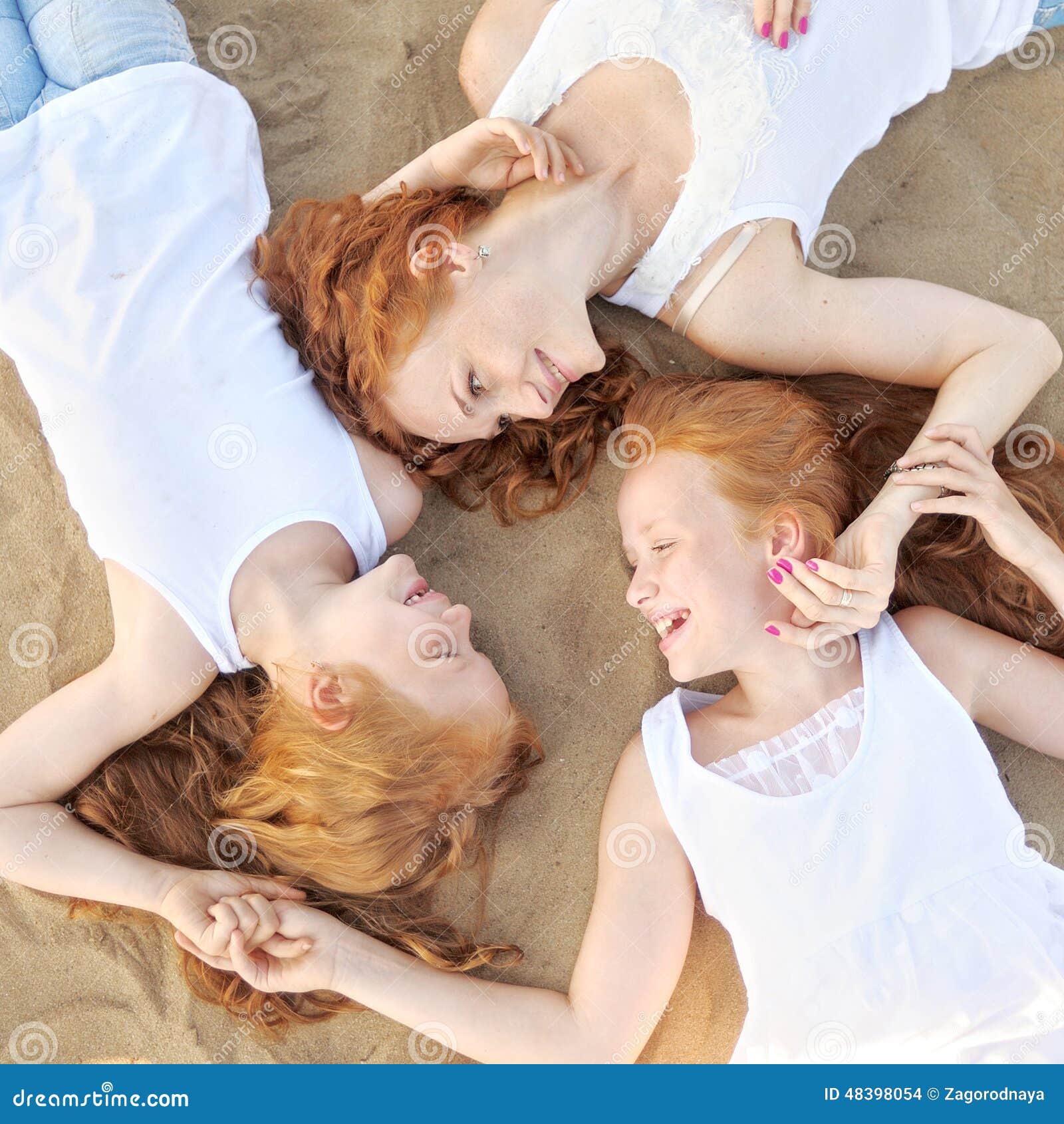 Three Children Playing on Beach Stock Photo - Image of genes, embrace ...