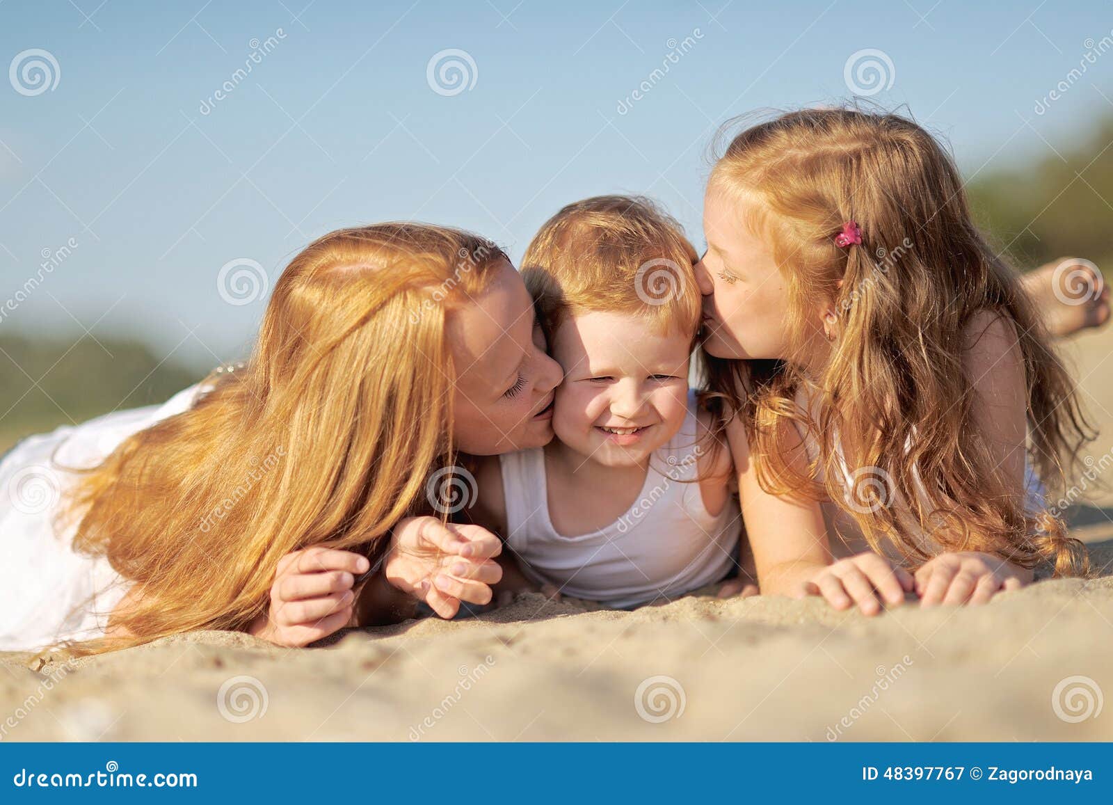 Three Children Playing on Beach Stock Image - Image of child, sand ...