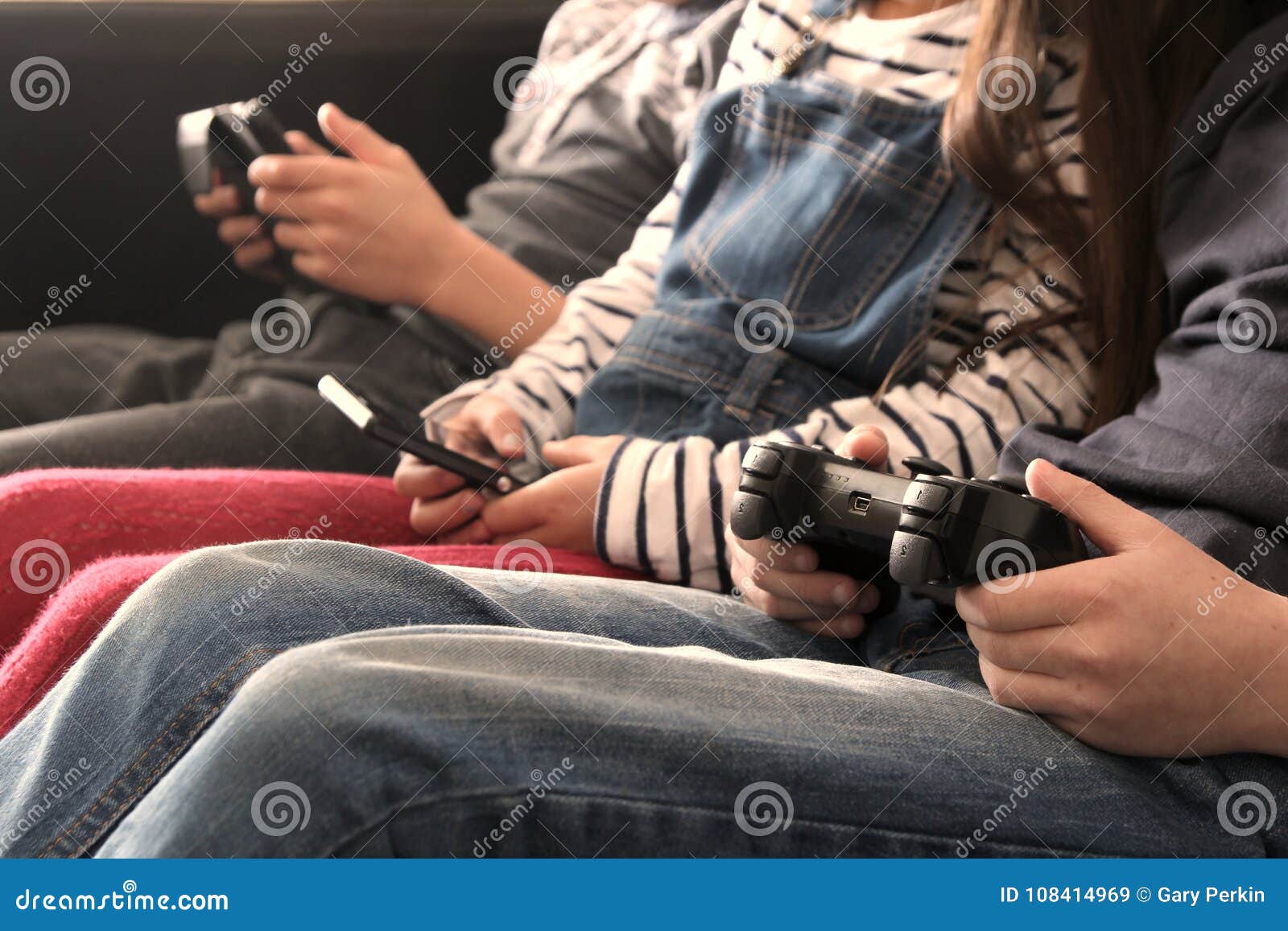Three Children Playing with Electronic Devices - Tablet, Smartphone and ...