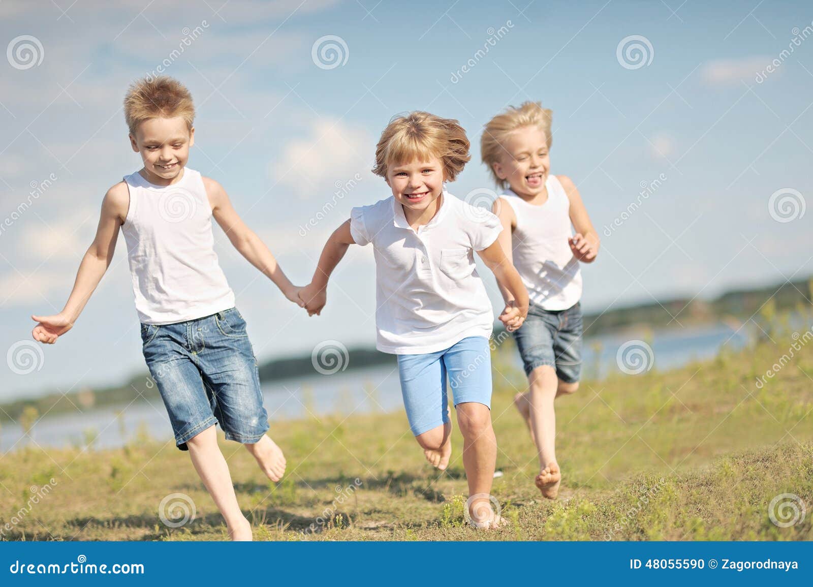 Three children playing stock photo. Image of group, nature - 48055590