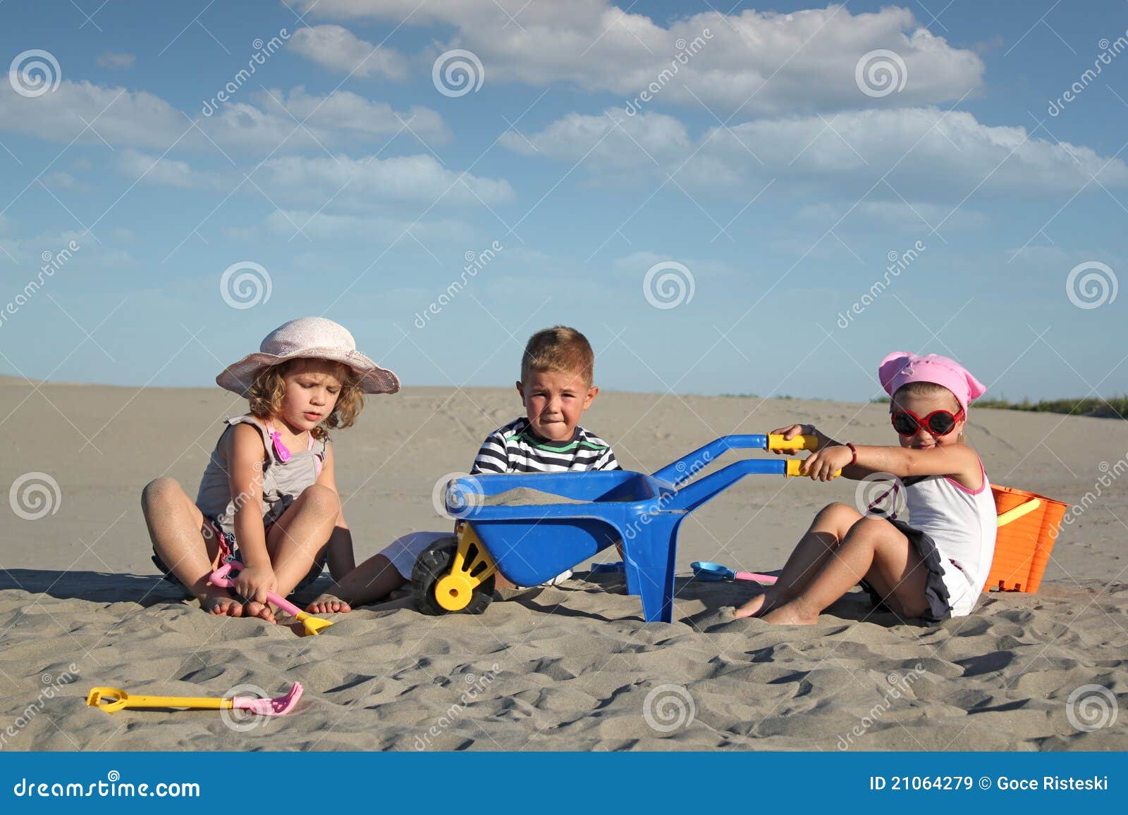 Three Children Playing in Sand Stock Image - Image of cloud, leisure ...