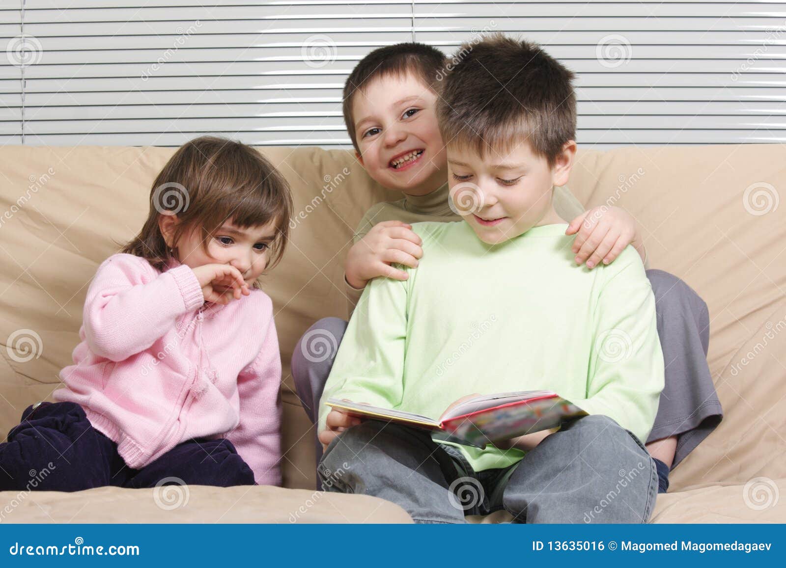 Three Children Reading Book Stock Photo - Image of smiling, positive ...