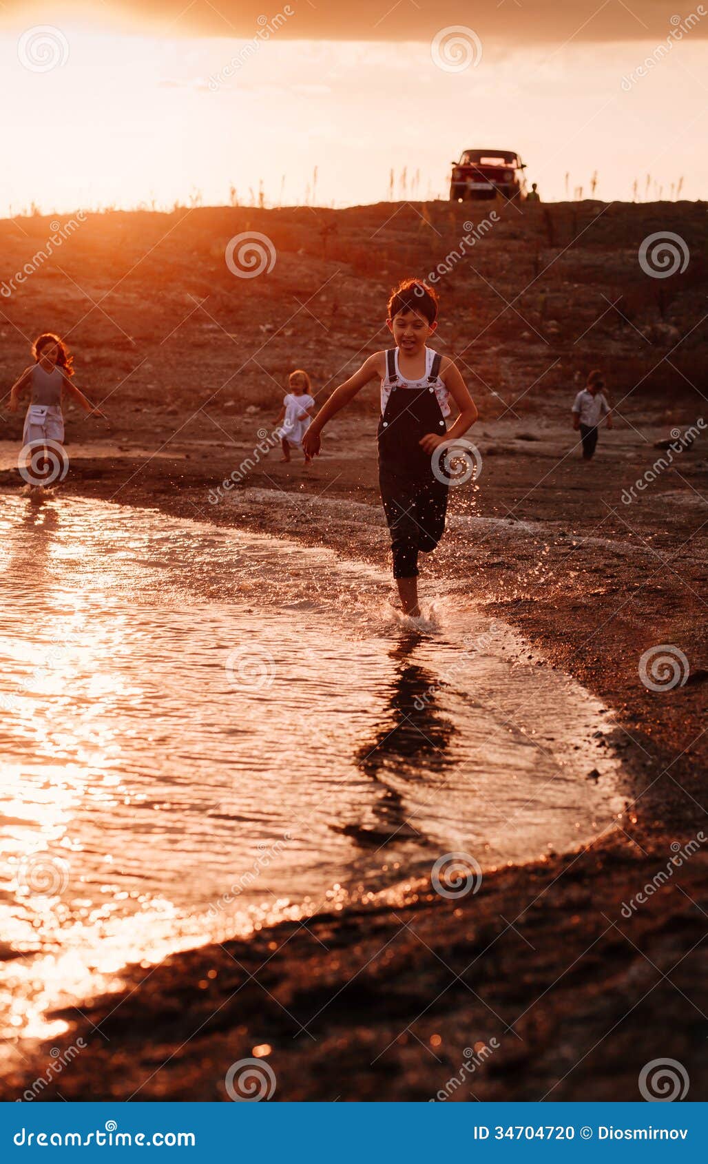 Three Children Running Along Beach Stock Photo - Image of length, sand ...
