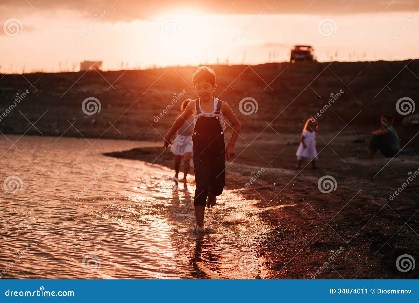 Three Children Running Along Beach Stock Image - Image of laughing ...