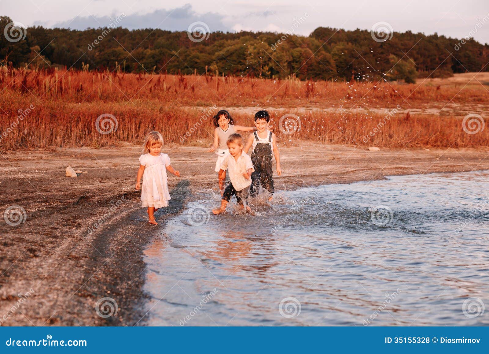 Three Children Running Along Beach Stock Photo - Image of girl, active ...