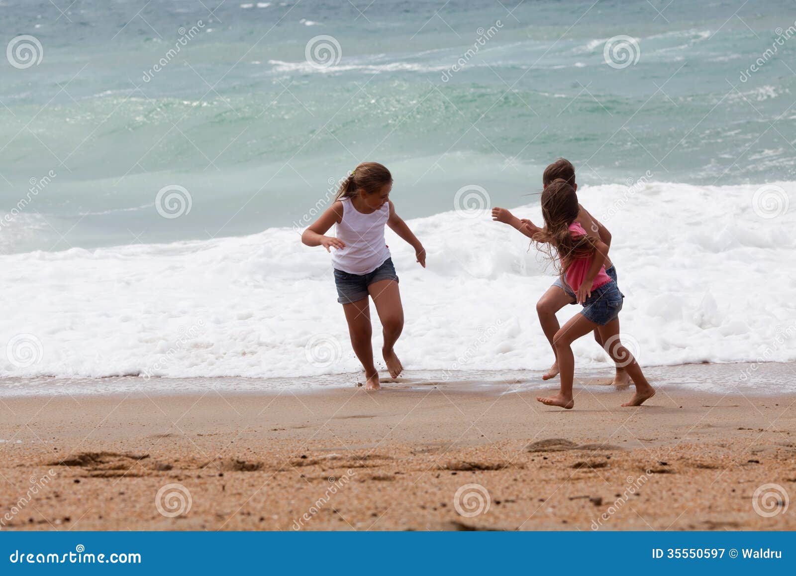 Three Children Running at the Beach Stock Image - Image of moving ...