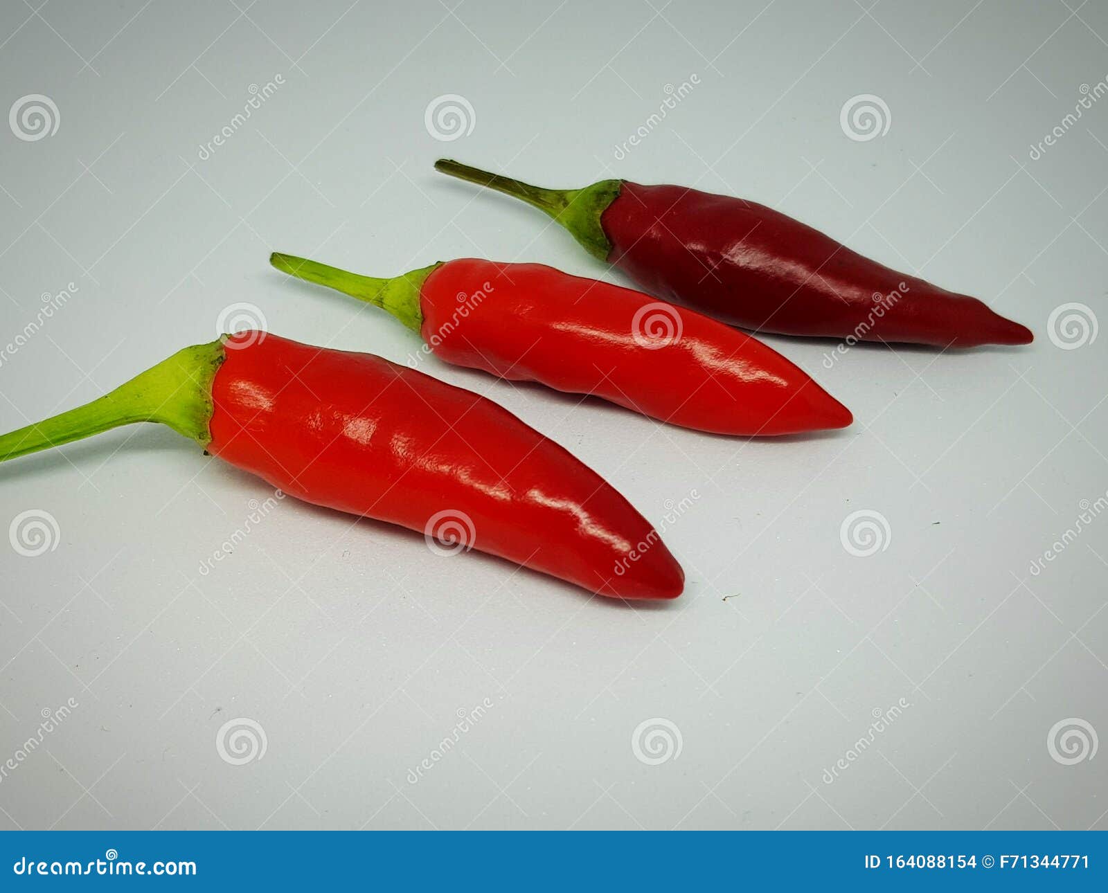 Three chili peppers stock photo. Image of paper, ripening - 164088154