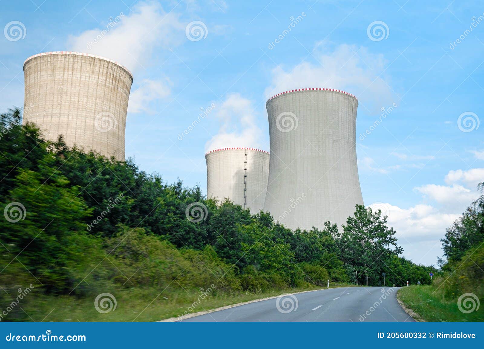 Three Chimneys of Nuclear Power Plant Near the Road. Stock Photo ...