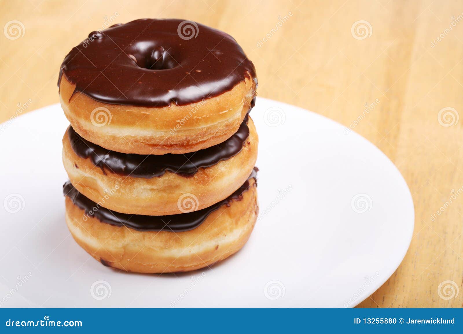 Three Chocolate Glazed Donuts Stock Photo - Image of covered, glazed ...