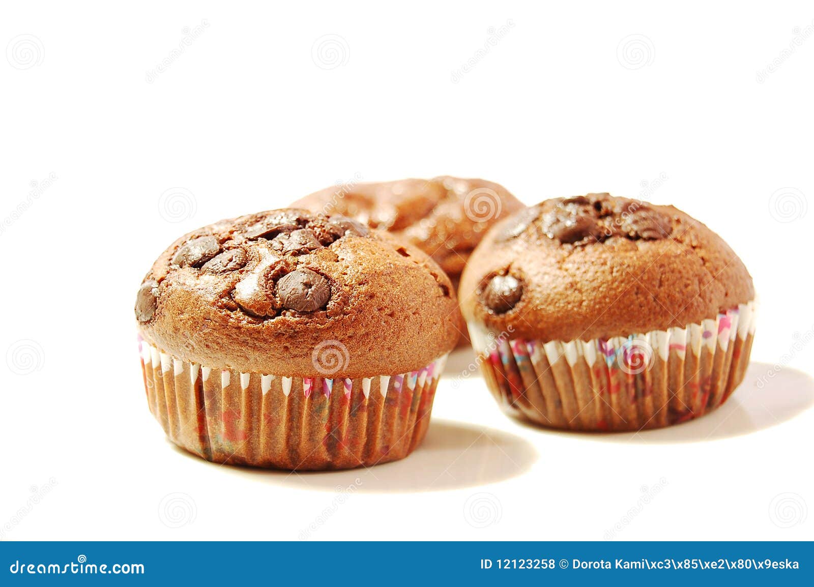 Three chocolate muffins stock photo. Image of food, baked - 12123258