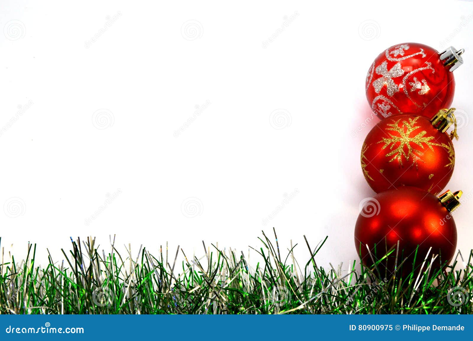 Three Christmas Balls and a Green Garland Placing Vertically Stock ...