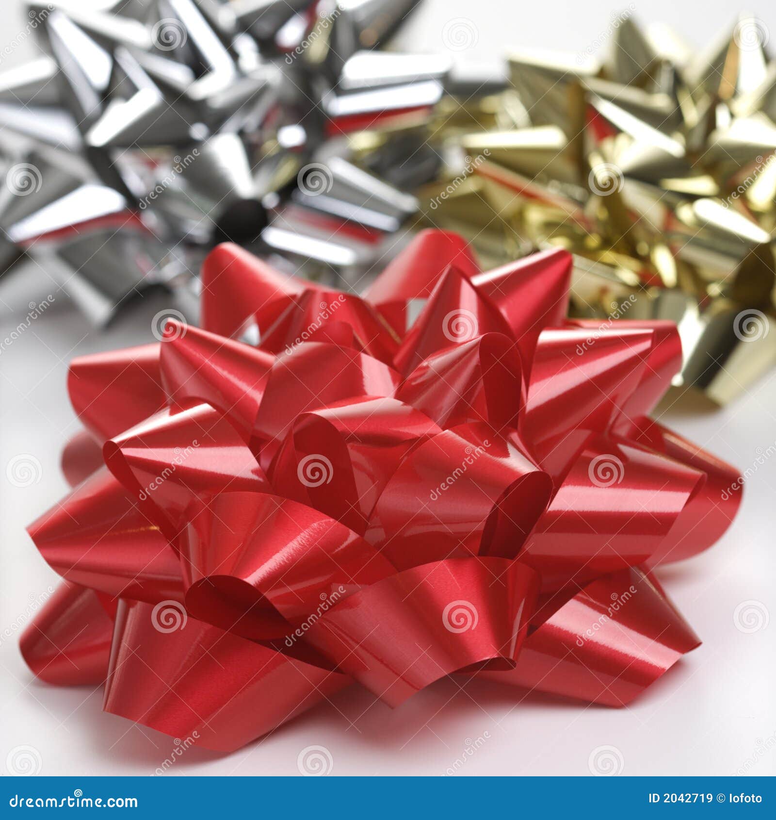 Three Christmas bows. stock image. Image of photograph - 2042719