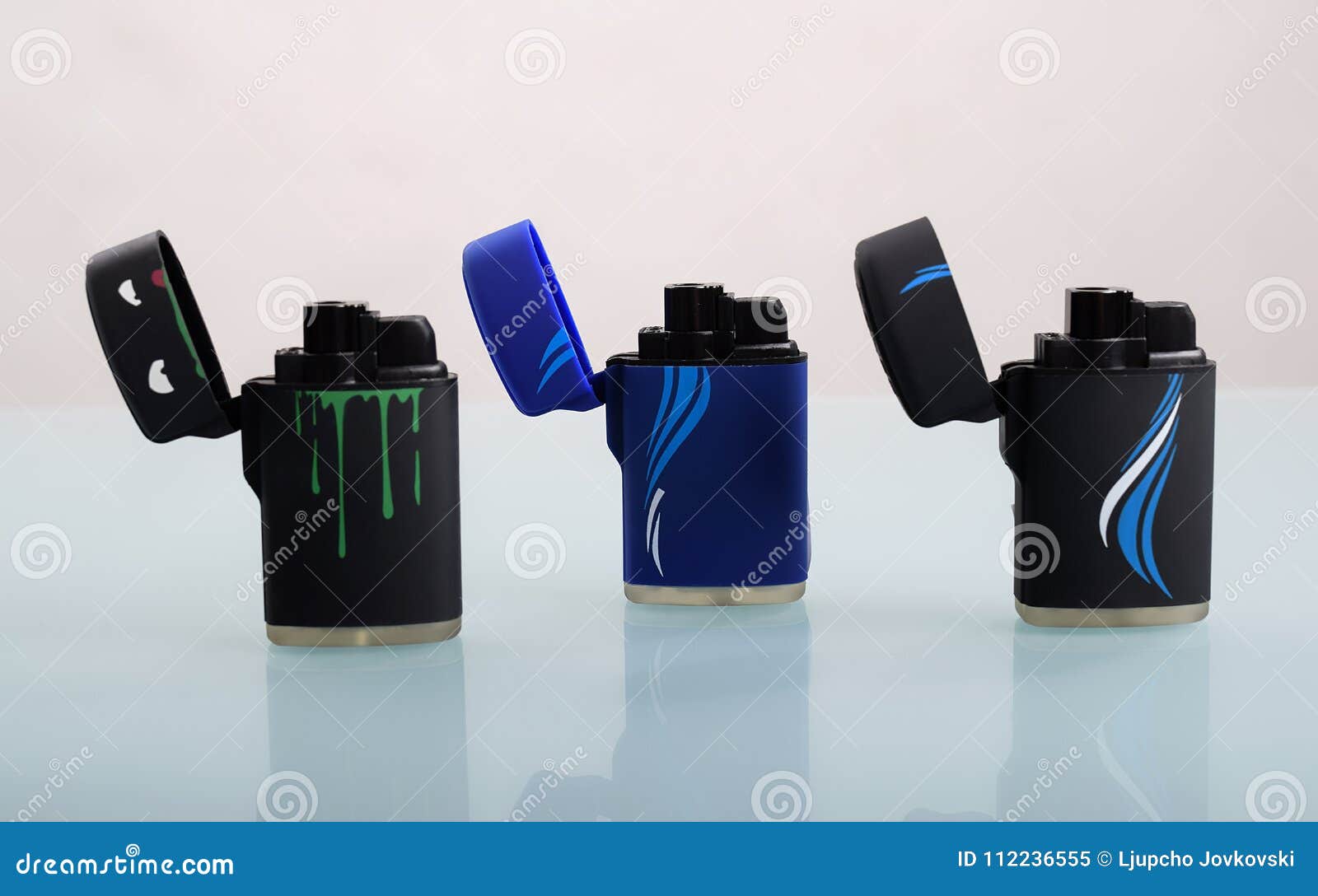 Three cigarette lighters stock image. Image of individual - 112236555