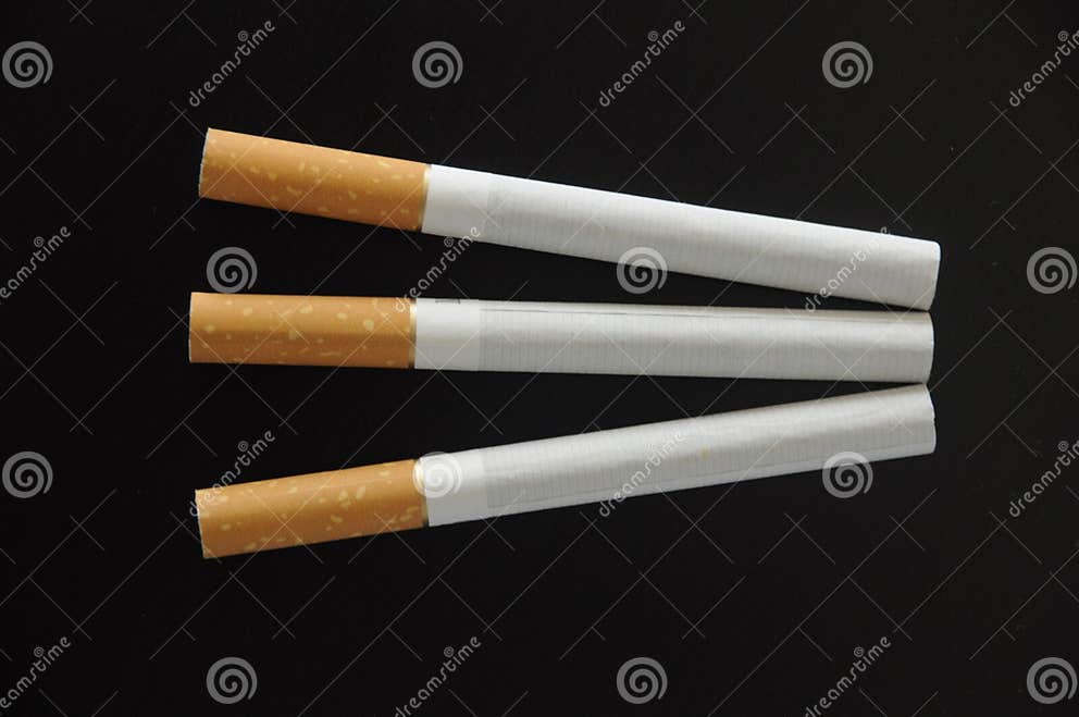 Three cigarettes stock image. Image of black, nicotine - 12785499