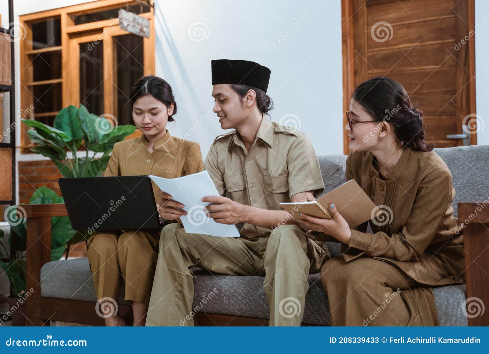 Three Civil Servants Working from Home Using Laptop Computers Stock ...
