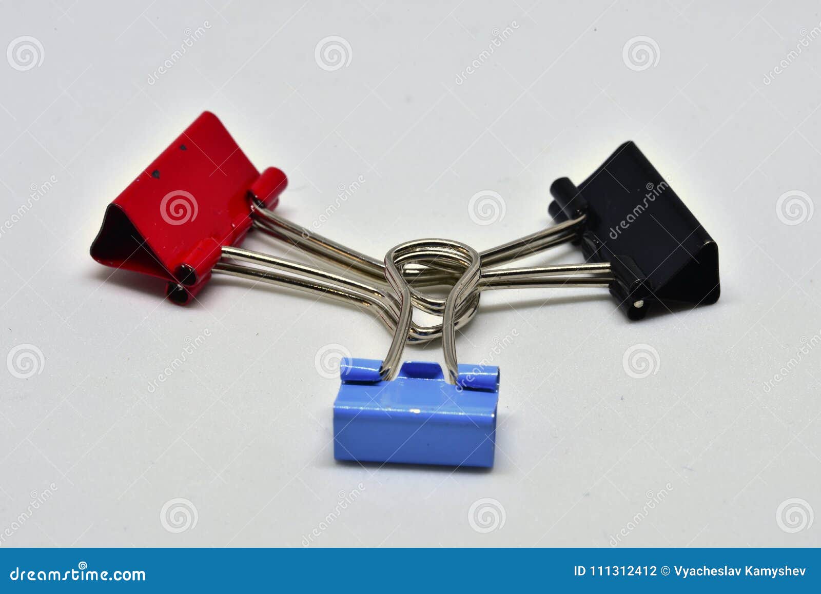Three clamps for paper. stock photo. Image of secure - 111312412