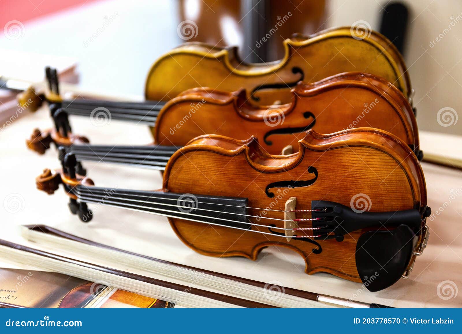 Classical Violins Standing on a Table Stock Photo - Image of ...