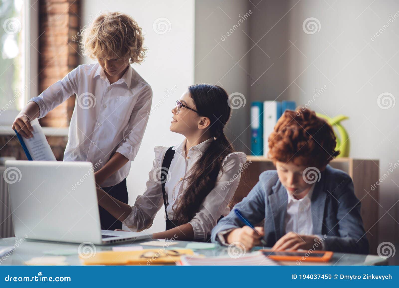 Three Classmates Working on a Project Together Stock Image - Image of ...