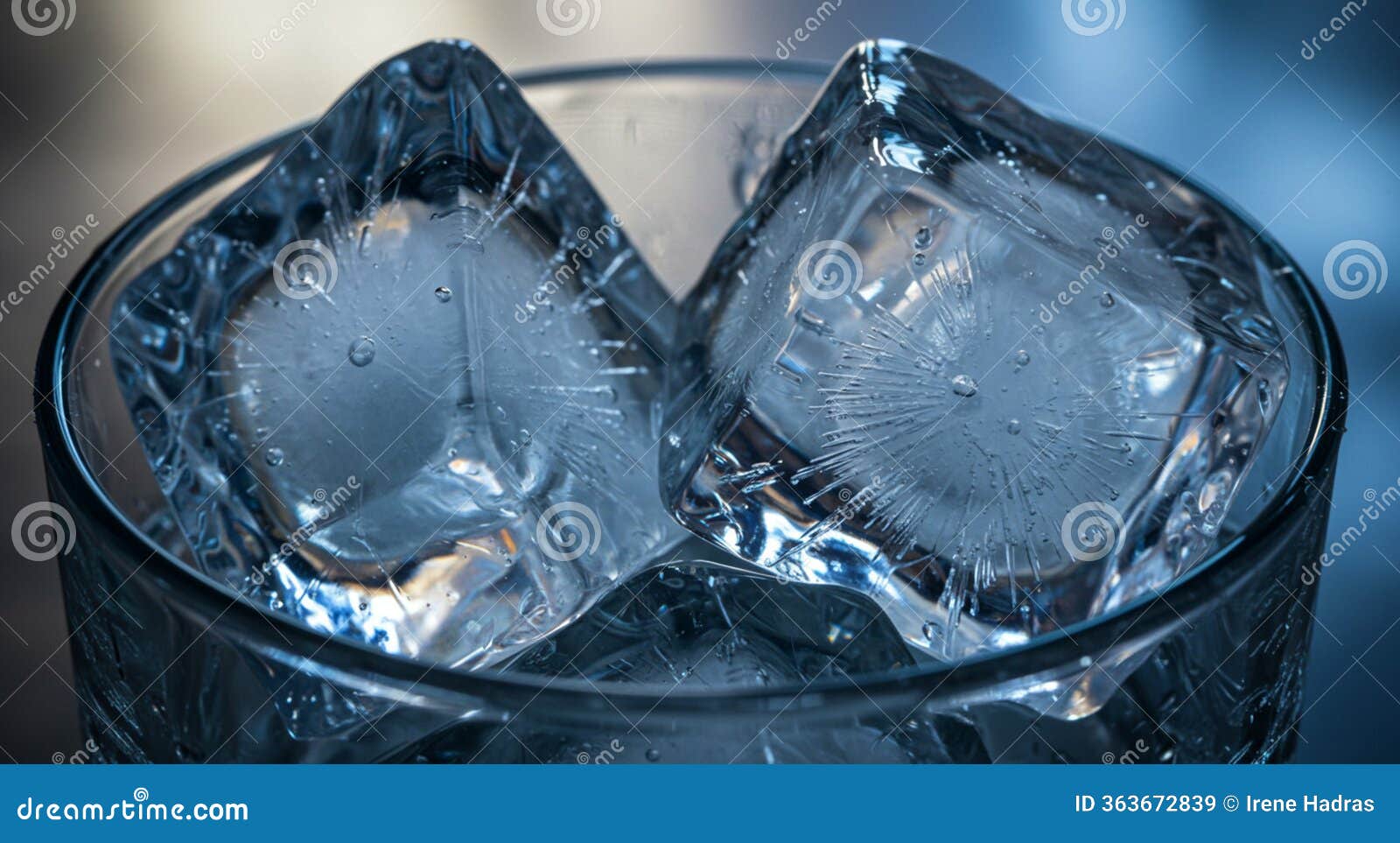 Three Clear Ice Cubes Are Stacked Inside A Transparent Glass. Each Cube ...