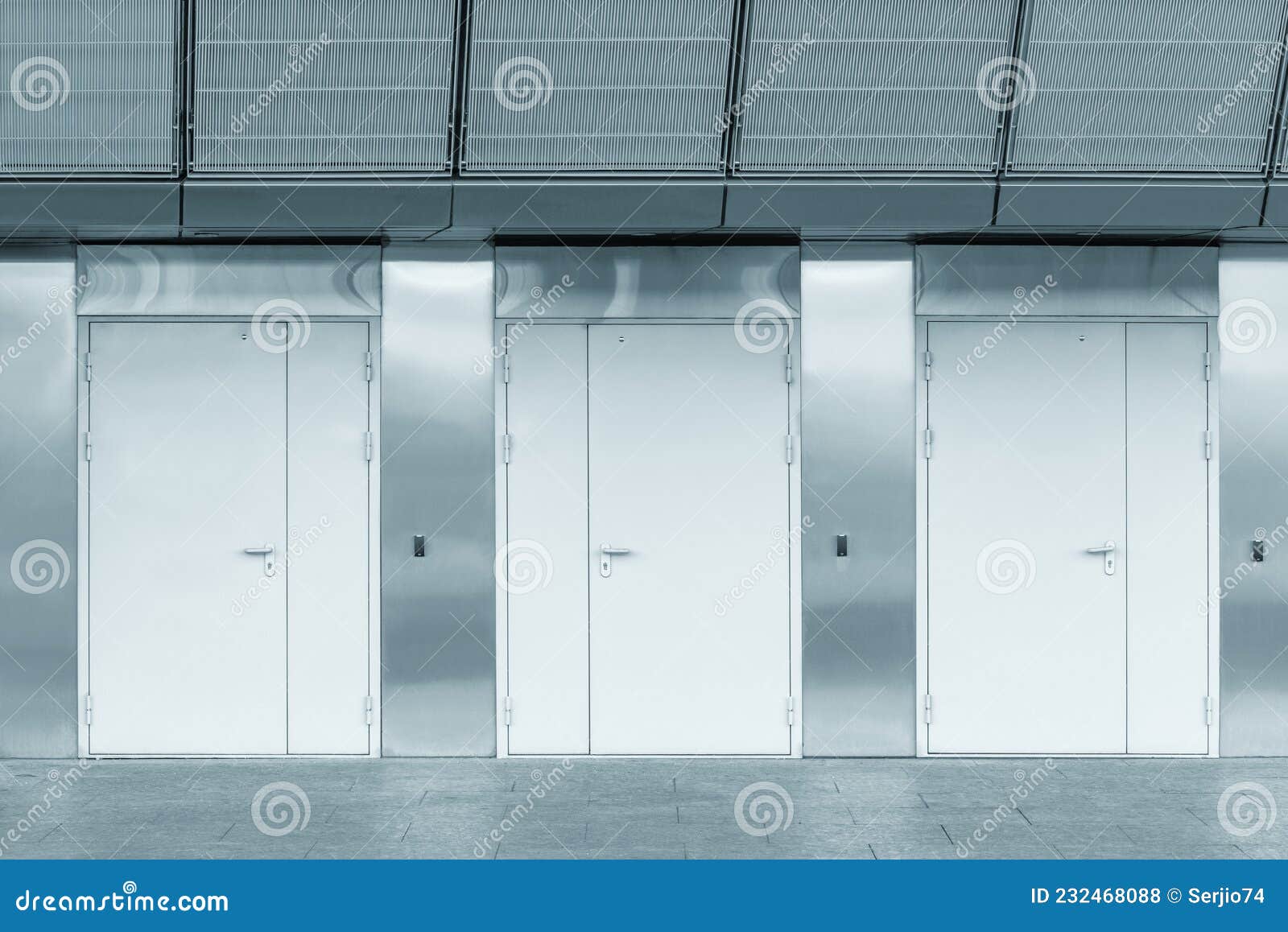 Three Closed Doors of the New Building Stock Photo - Image of hangar ...