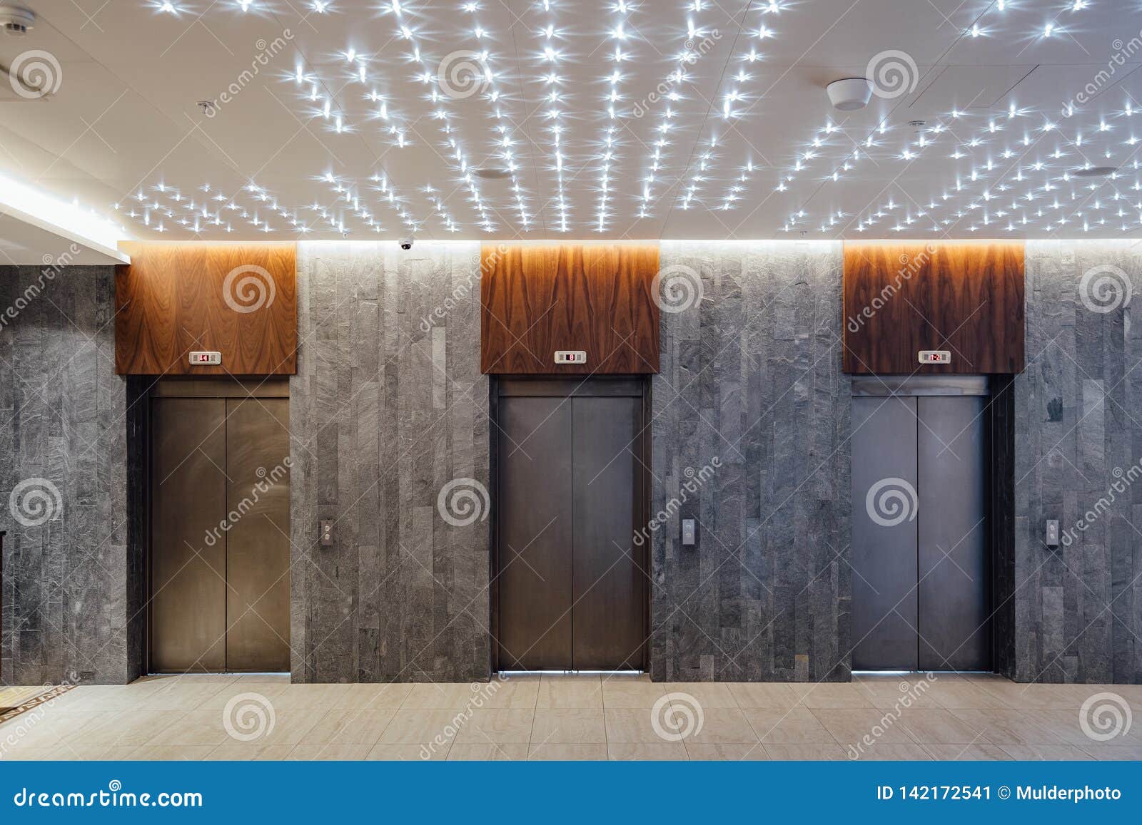 Three Closed Elevators in Modern Hotel Lobby Stock Image - Image of ...