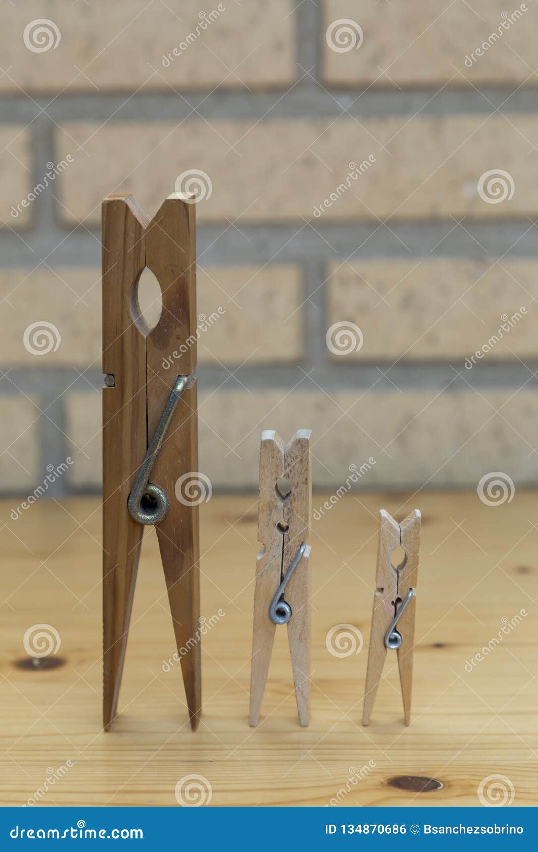 Three Clothespins of Different Size Stock Photo - Image of home, large ...