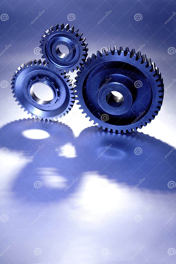 Three cogs together stock image. Image of studio, color - 3587117