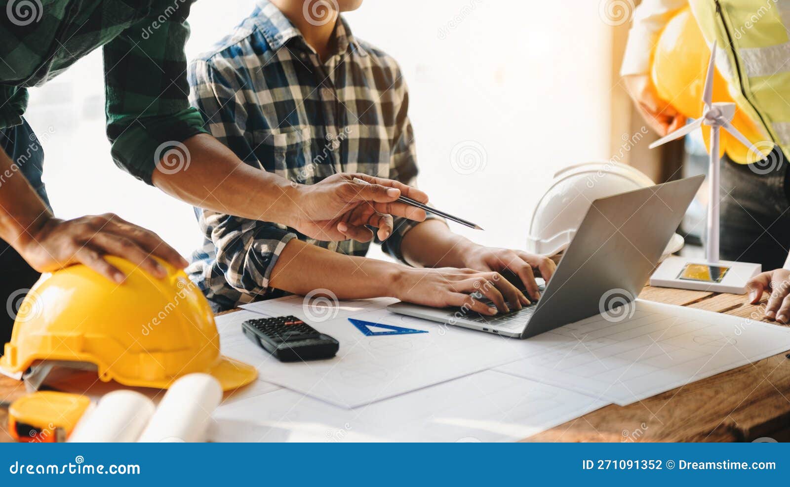 Three Colleagues Discussing Data Working and Tablet, Laptop with on on ...