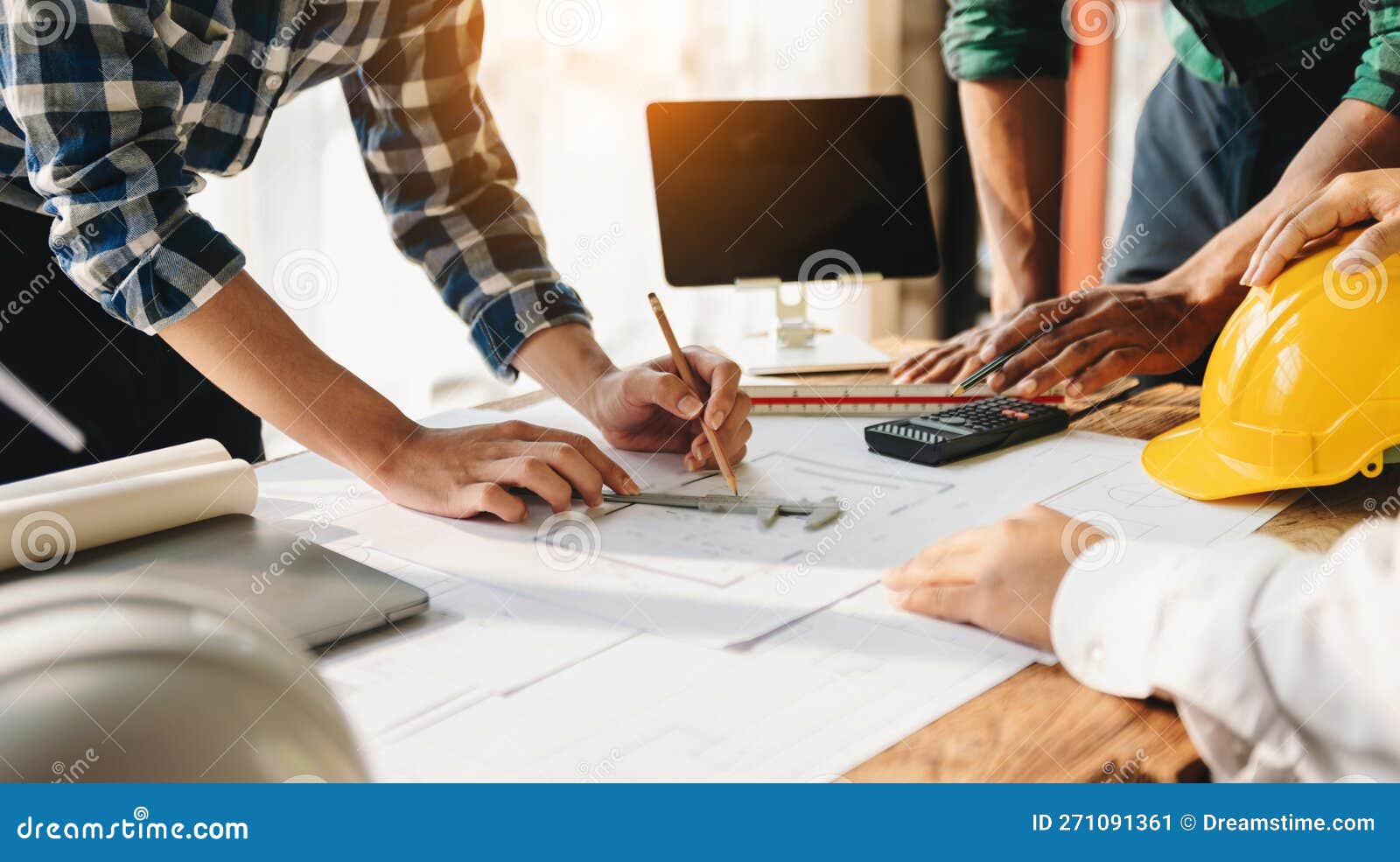 Three Colleagues Discussing Data Working and Tablet, Laptop with on on ...