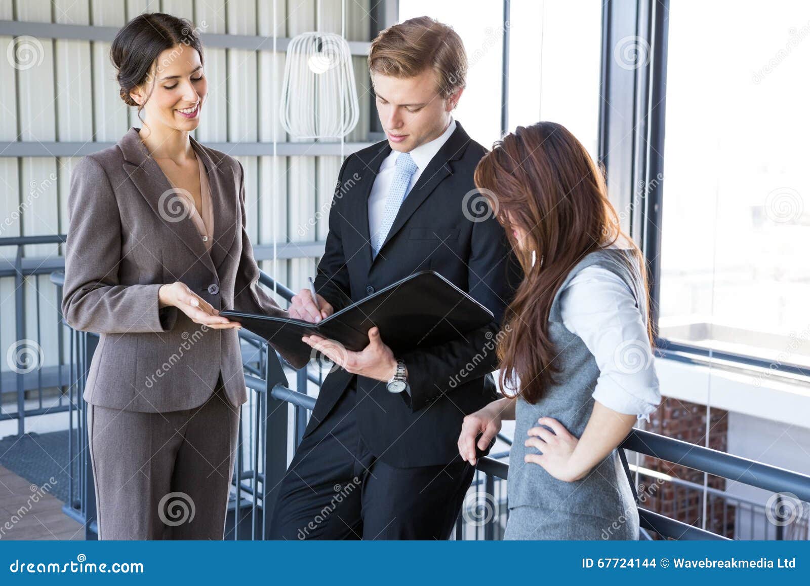 Three Colleagues Discussing in Office Stock Photo - Image of executive ...