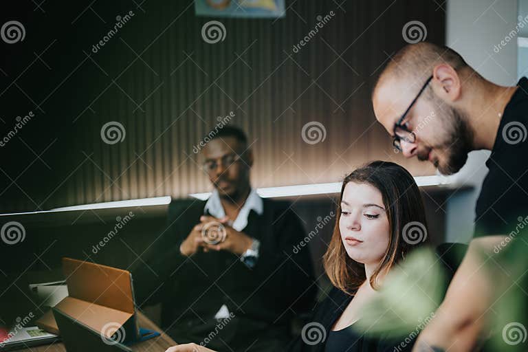 Business Team Collaborating on Project Tasks in a Modern Office Setting ...