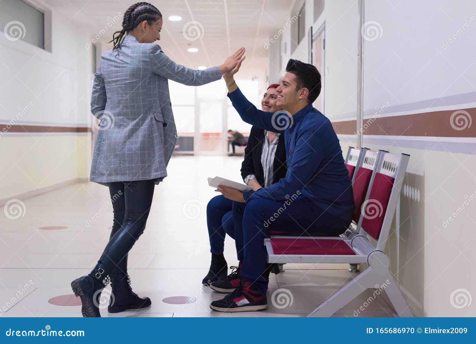 Three College Students Sitting and Chatting after Their Class. Group of ...
