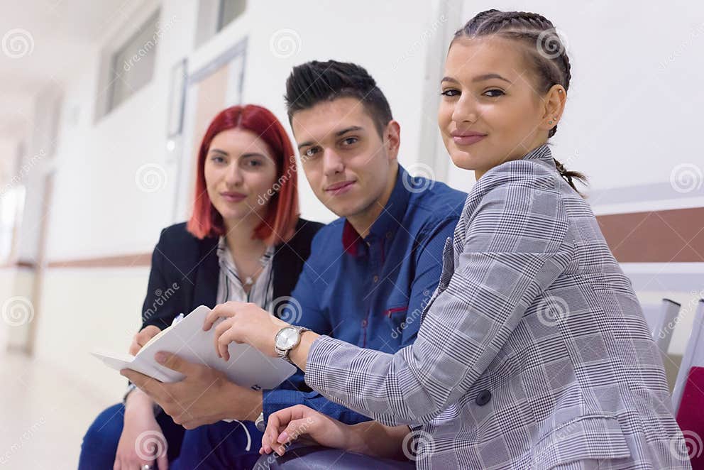 Three College Students Sitting and Chatting after Their Class. Group of ...