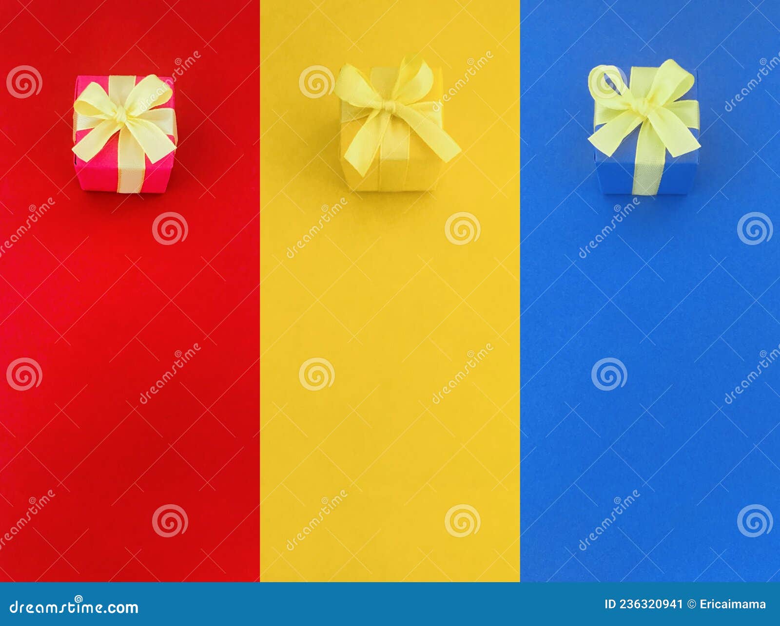 Three Colour Gift Boxes with a Yellow Satin Ribbon Bow on Their Same ...