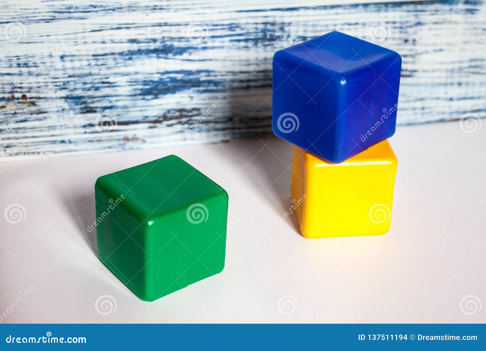 Three colored cubes stock photo. Image of cubes, table - 137511194 Three colored cubes stock photo. Image of cubes, table - 137511194