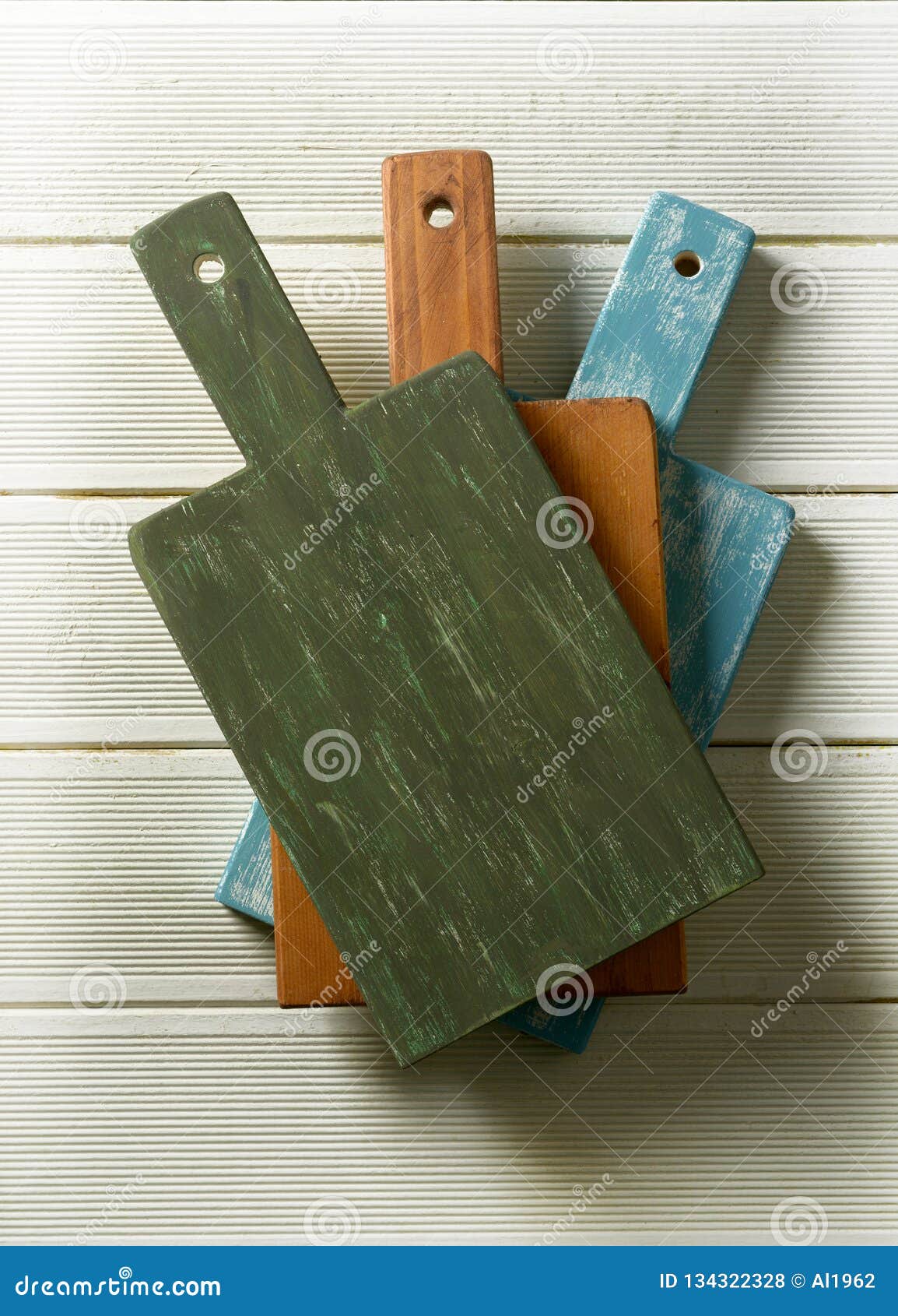 Three Colored Cutting Boards on White Table Stock Photo - Image of ...