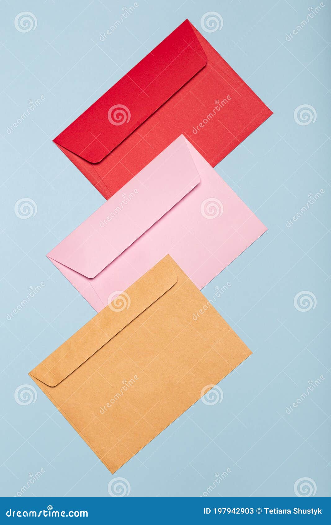 Three Colored Envelopes on Blue Background Top View Stock Image - Image ...