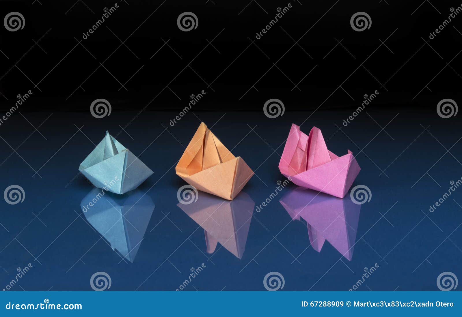 Three colored paper boats stock image. Image of sailing - 67288909