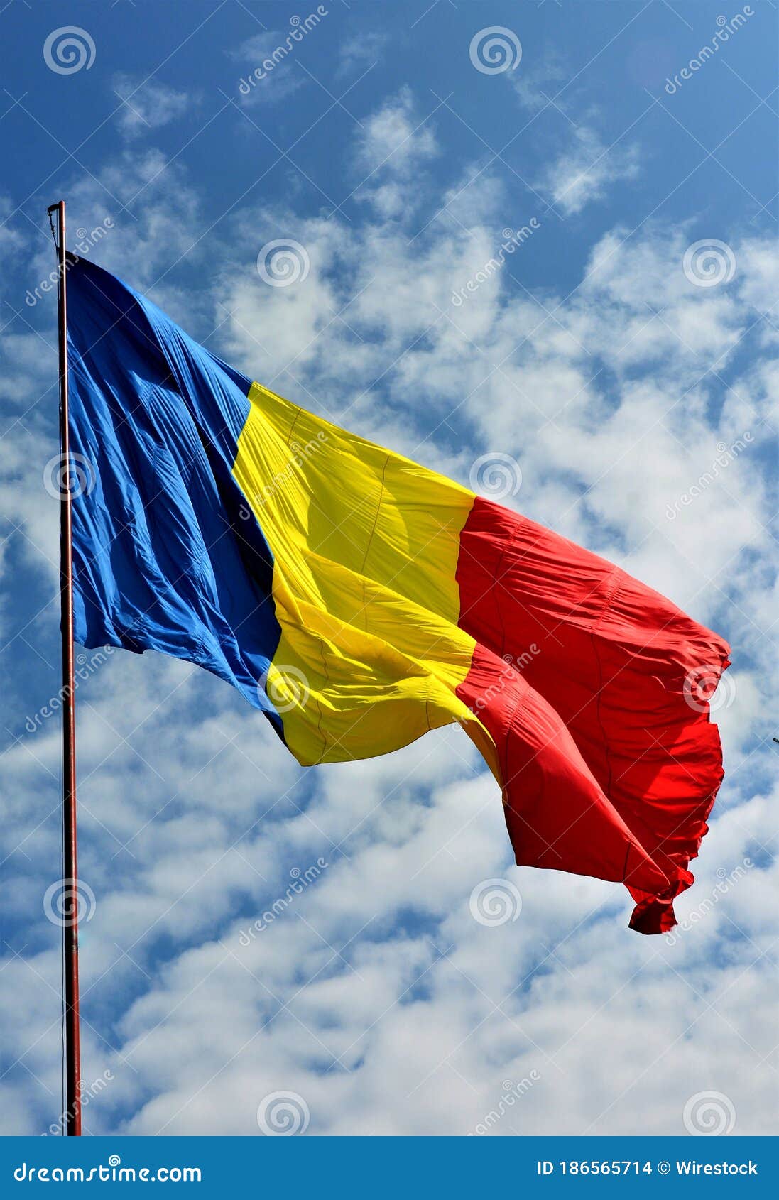 Three-colored Romanian Flag Against the Blue Sky Stock Photo - Image of ...