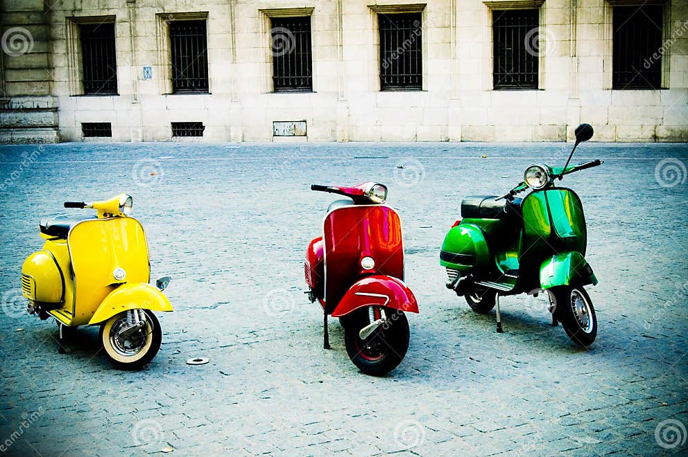 Three Colored Scooters Plaza Stock Image - Image of green, steel: 1852817