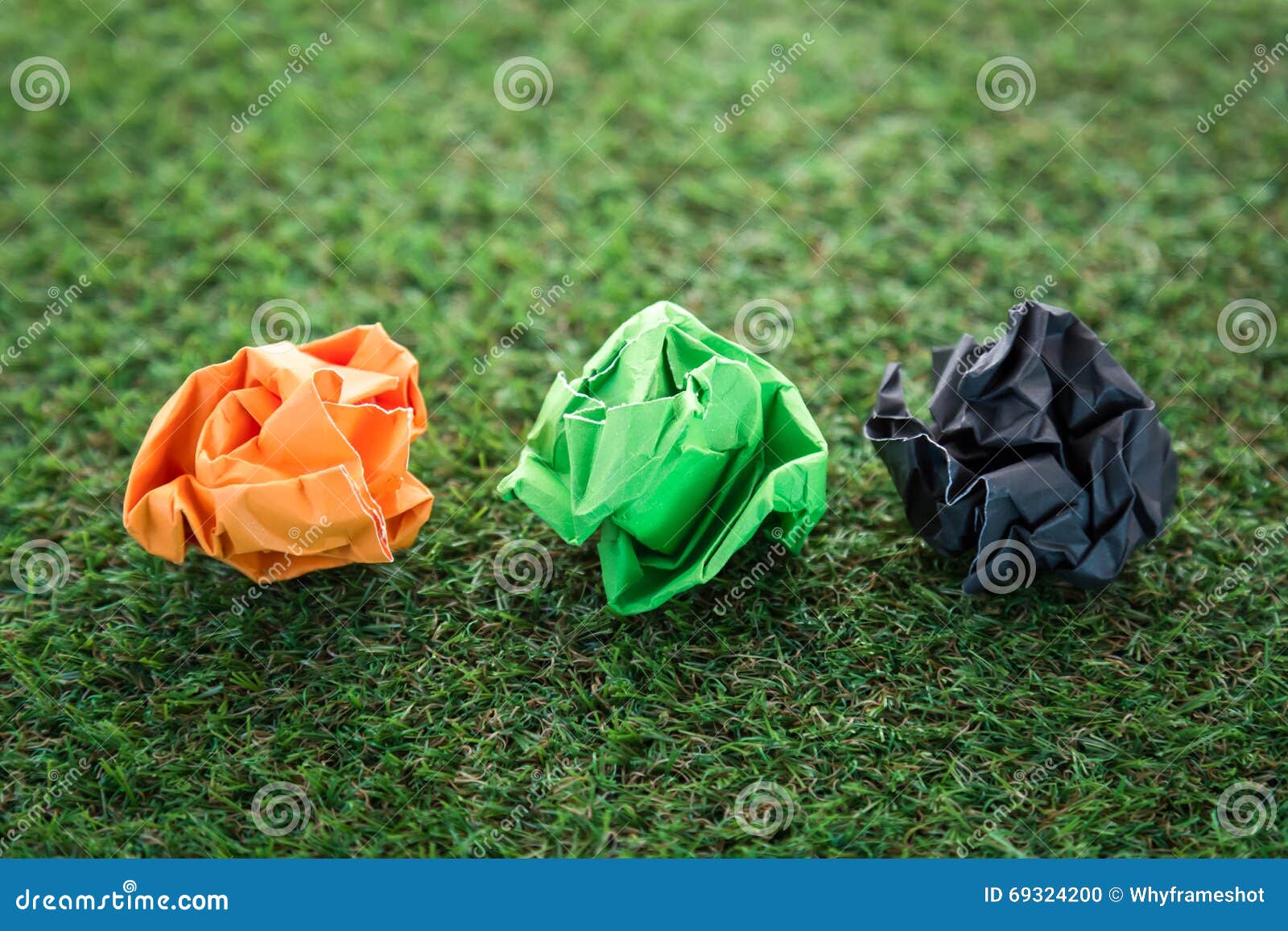 Three Colorful Paper Trash Balls on Green Grass Stock Photo - Image of ...