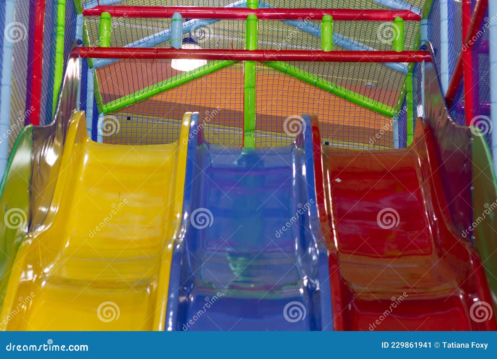 Three Colorful Slides for Children in Play Center Stock Image - Image ...
