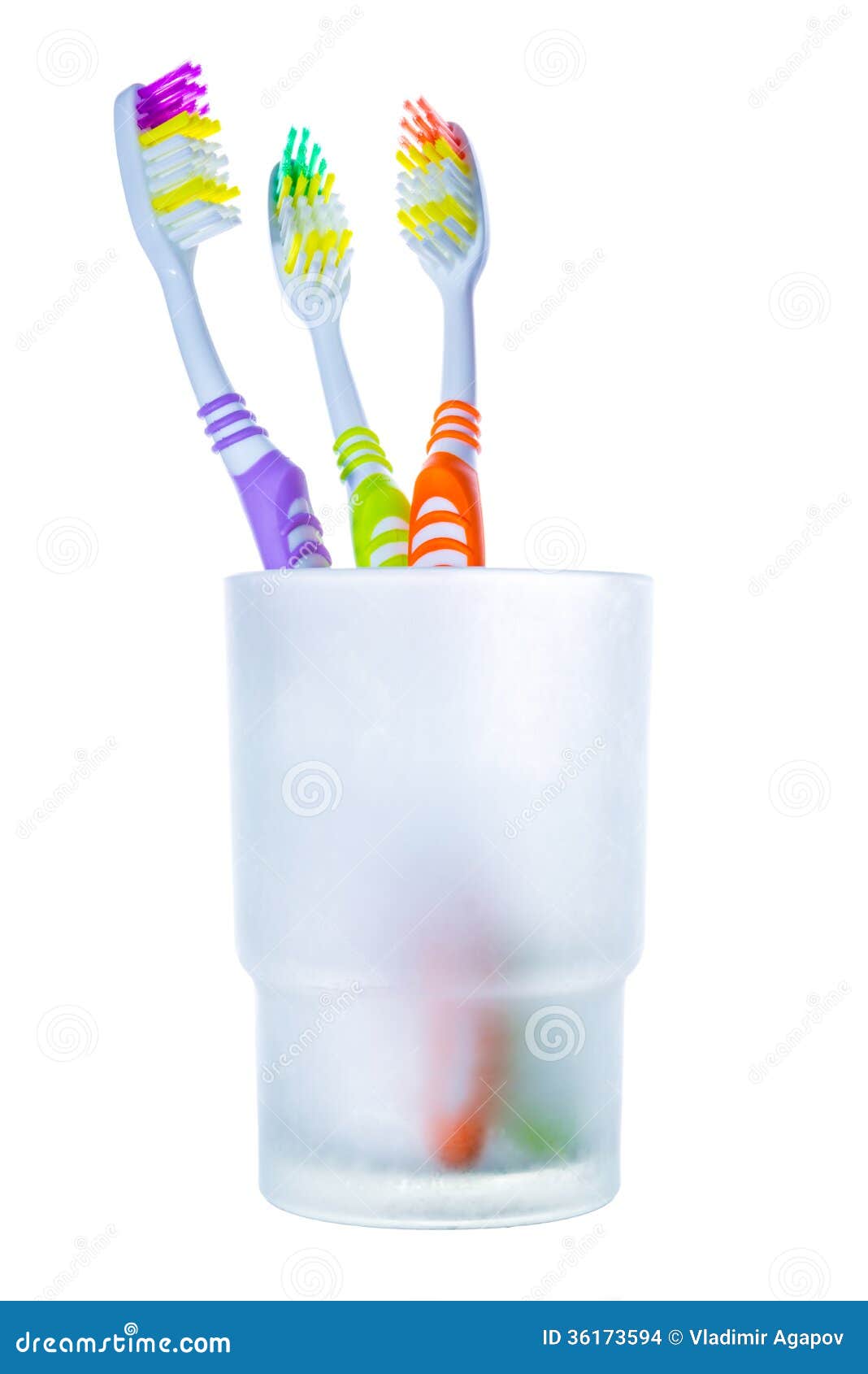 Three Colorful Toothbrushes in Glass Stock Photo - Image of brush ...
