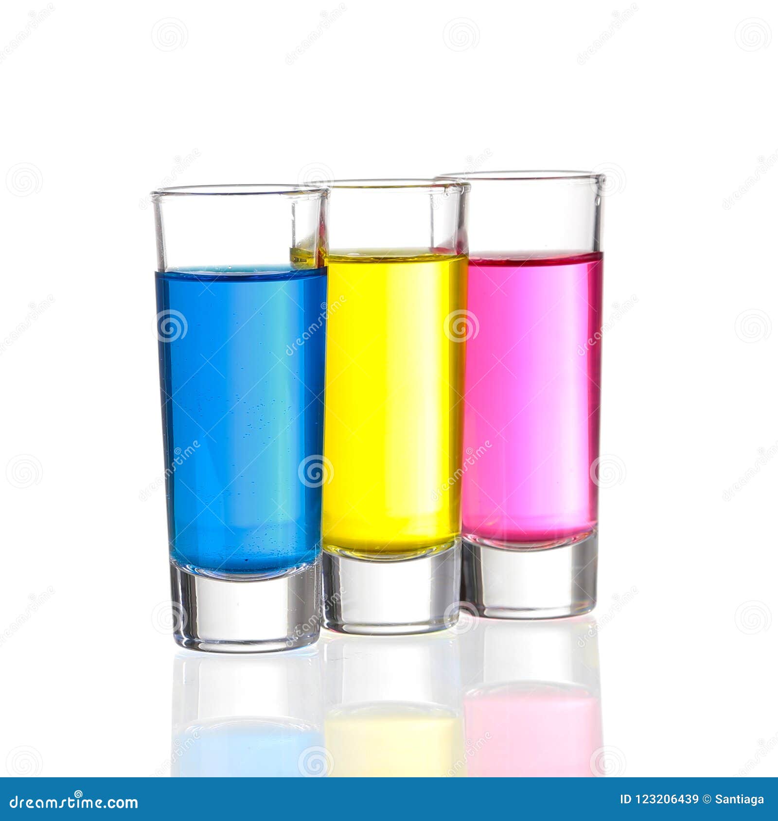 Three Colourful Shot Drinks on a White Background with Reflections ...