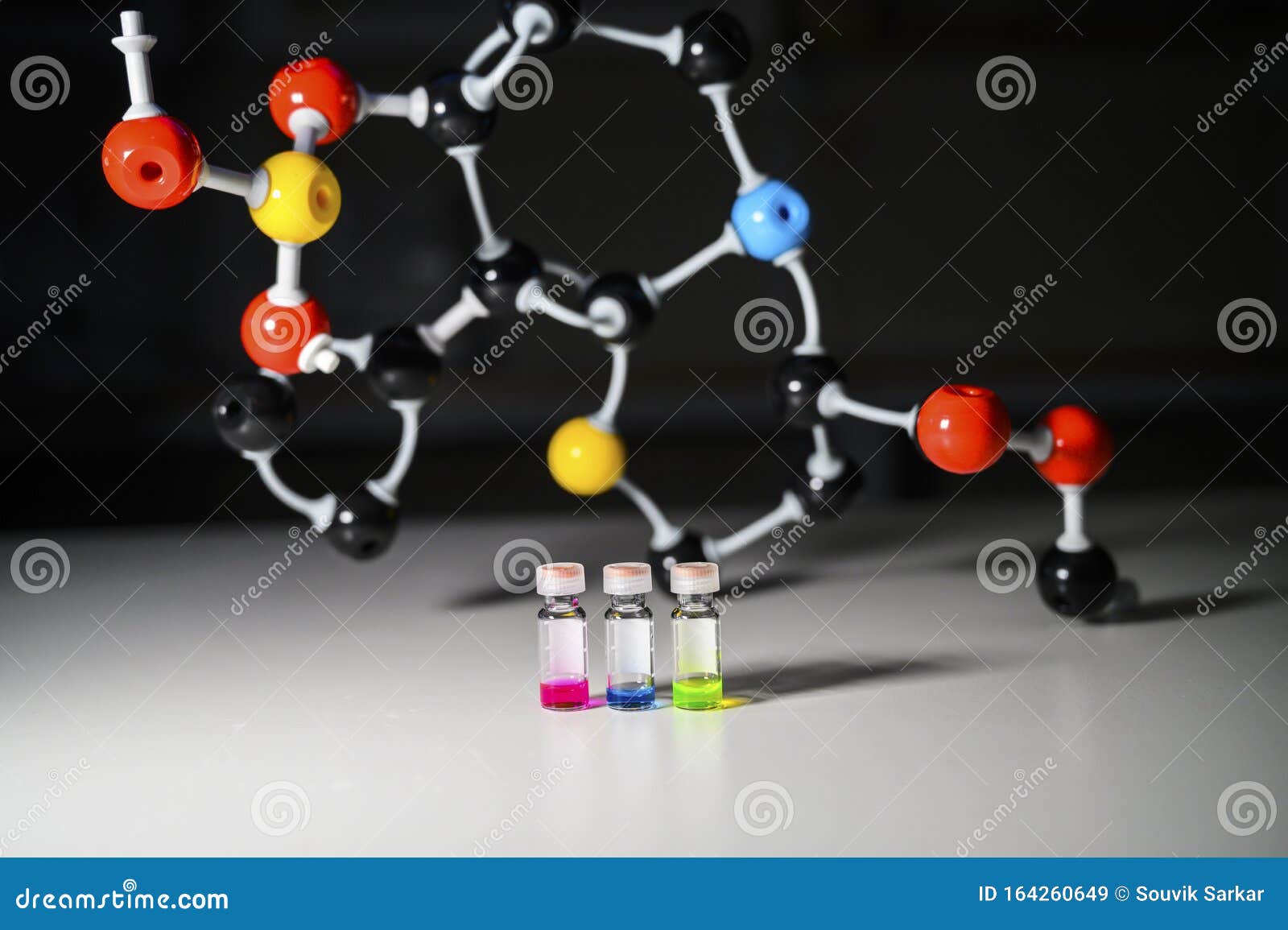 Three Colourful Solution in Different LCMS Glass Vial on a White Bench ...