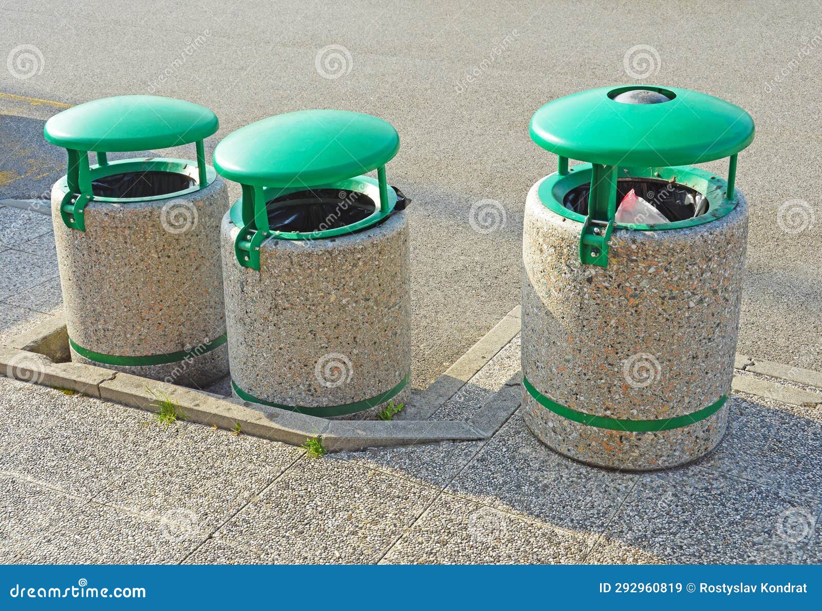 Three concrete dumpsters stock image. Image of green - 292960819