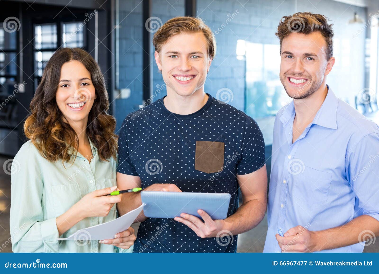 Three Confident Colleagues Discussing in Office Stock Image - Image of ...