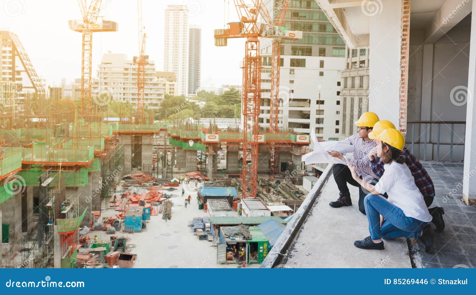 Three Construction Engineers Working Together in Construction Si Stock ...